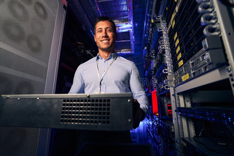 Smiling Pleased Engineer Demonstrating New Hardware Component Stock ...