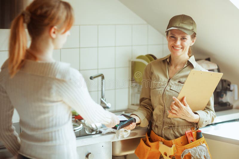 Plumber Payment: Card Transaction in Kitchen Stock Image - Image of ...