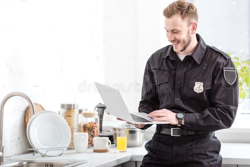 Smiling Police Officer Standing and Using Laptop Stock Photo - Image of ...