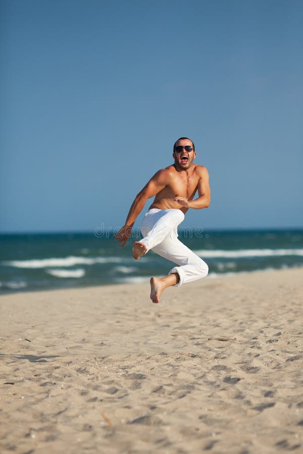 Smiling Portrait of Man Sitting on the Beach Stock Image - Image of ...