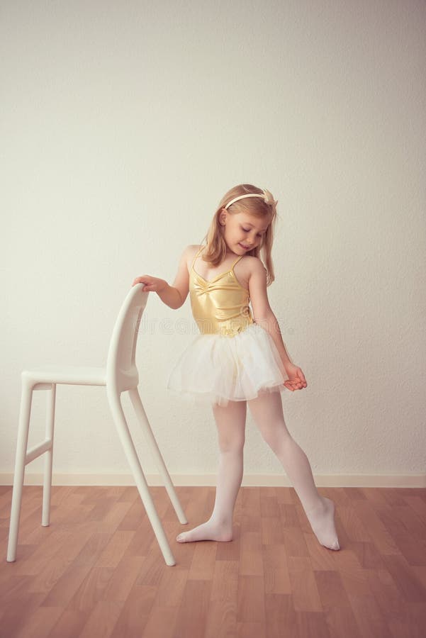 Pretty Smiling Ballet Girl in White-yellow Tutu Sitting on Chair Stock ...