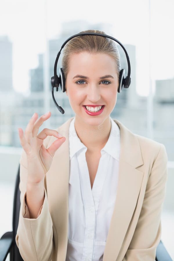 Pretty Call Center Agent Typing while on a Call Stock Photo - Image of ...