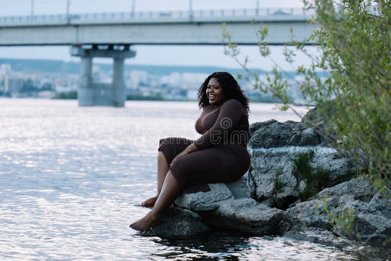 Smiling Pretty Curly Black Haired Plump African American Interracial