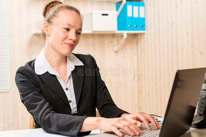 Smiling Pretty Secretary Typing Text on Computer Stock Image - Image of ...