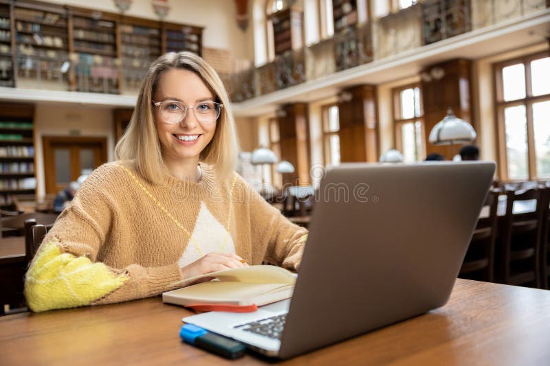 Smiling Pretty Woman Working in the Library Stock Photo - Image of ...
