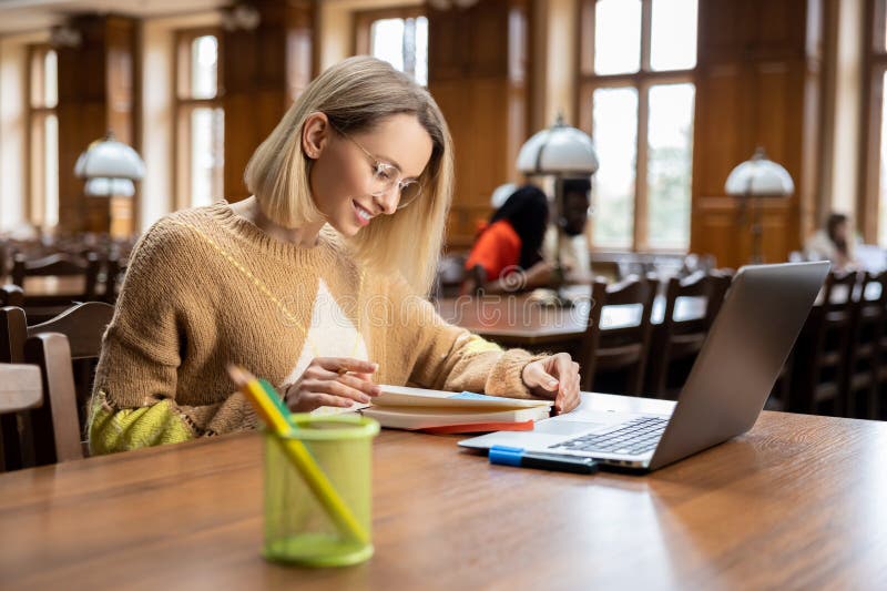 Smiling Pretty Woman Working in the Library Stock Image - Image of ...