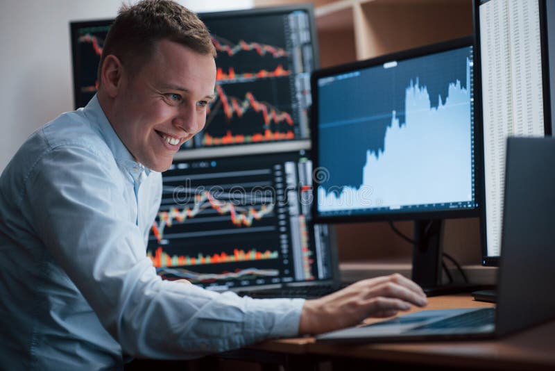 Smiling during the Process. Man Working Online in the Office with ...