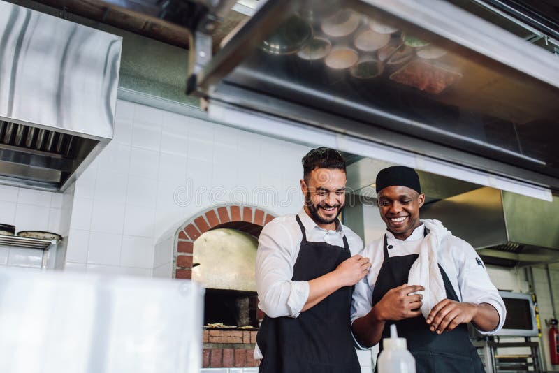 Smiling Chef Cooking Food at Restaurant Kitchen Stock Photo - Image of ...