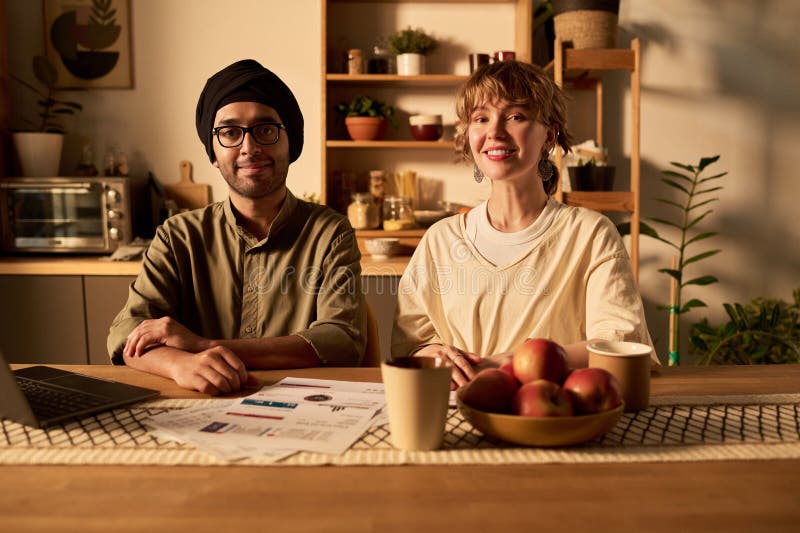 Smiling Professional Colleagues Working at Office Table Stock Photo ...