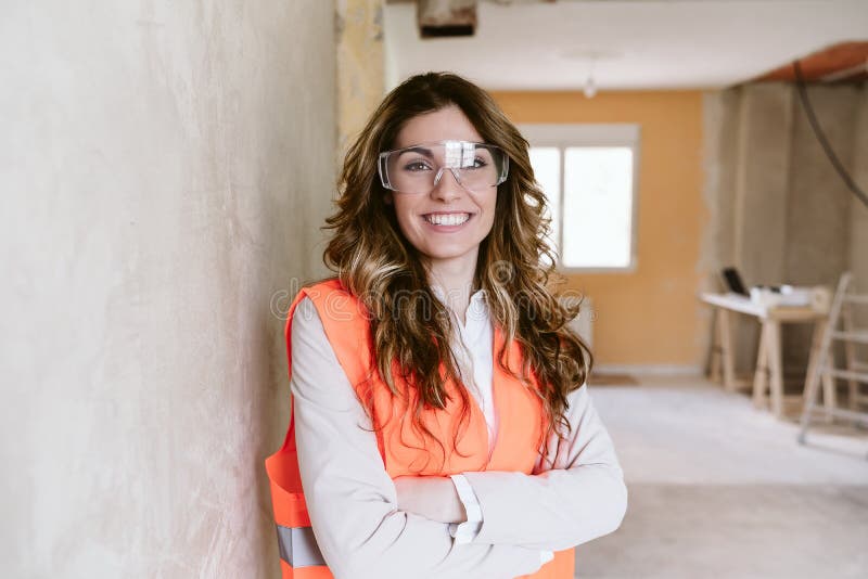 Smiling Professional Confident Architect Woman in Construction Site ... Smiling Professional Confident Architect Woman in Construction Site ...