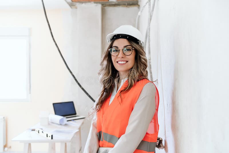 Smiling Professional Confident Architect Woman in Construction Site ... Smiling Professional Confident Architect Woman in Construction Site ...