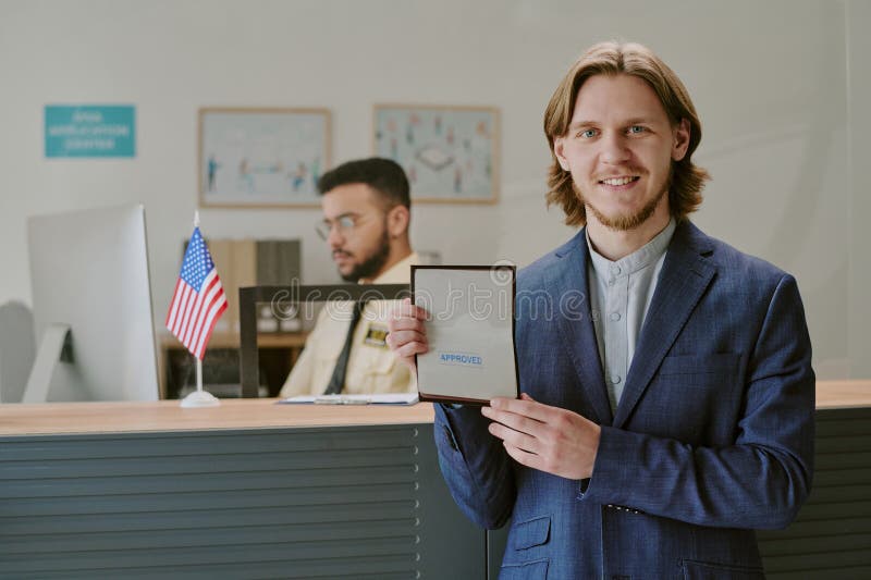 Smiling Professional Holding Up Document Office Setting Stock Photos ...
