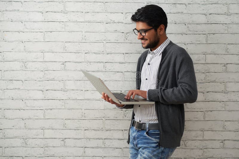 Cheerful Programmer with Laptop Stock Photo - Image of programming ...