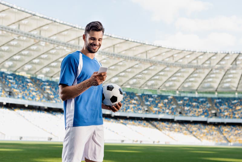 Smiling Professional Soccer Player in Blue Stock Photo - Image of game ...