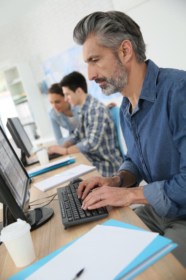 Smiling Professor Working on Desktop Computer Stock Image - Image of ...