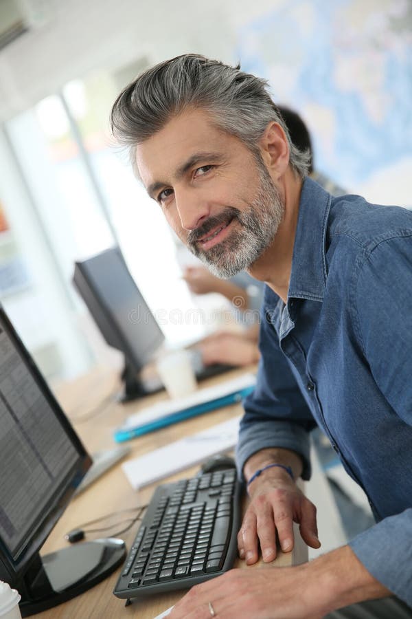 Smiling Professor Working on Desktop Computer Stock Image - Image of ...