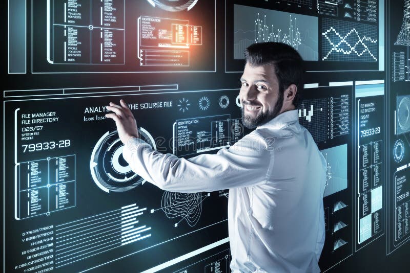 Smiling Programmer Touching the Transparent Screen while Being at Work ... Smiling Programmer Touching the Transparent Screen while Being at Work ...