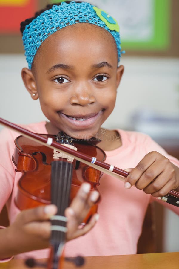 Smiling Pupil Playing Violin in a Classroom Stock Photo - Image of ...