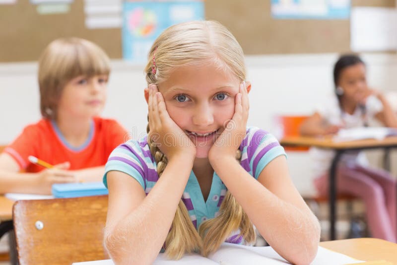 Smiling Pupil Sitting at Her Desk Stock Image - Image of back, portrait ...