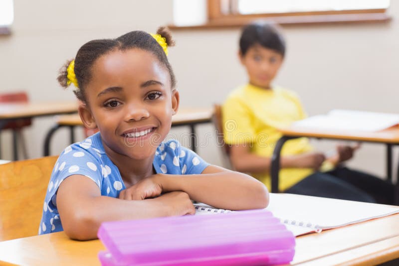 Smiling Pupil Sitting at Her Desk Stock Photo - Image of childhood ...