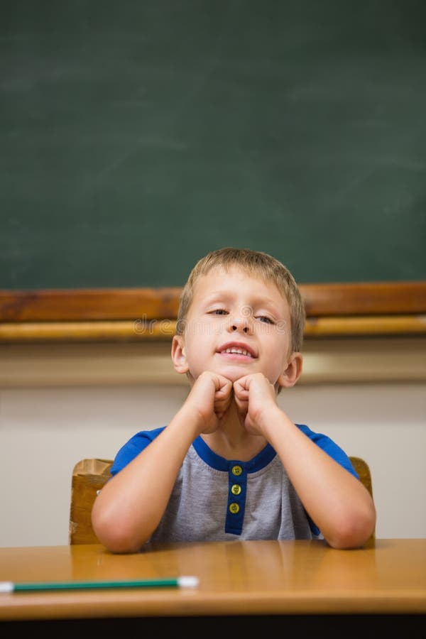 Smiling Pupil Sitting at His Desk Stock Photo - Image of sitting ...