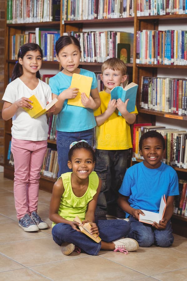 Smiling Pupils with Books in the Library Stock Photo - Image of indoors ...