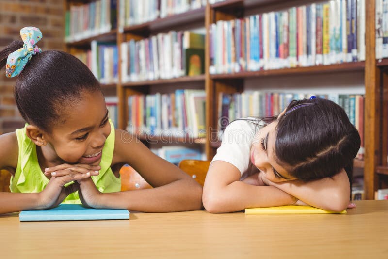 Smiling Pupils Leaning on Books in the Library Stock Image - Image of ...