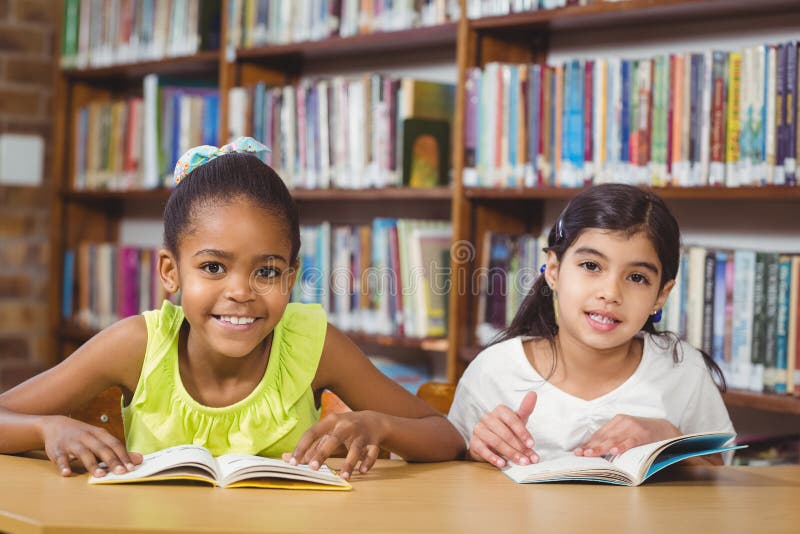 Smiling Pupils Reading Books in the Library Stock Image - Image of ...