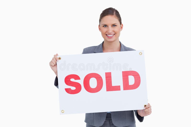 Smiling Real Estate Agent Presenting Sold Sign Stock Photo - Image of ...