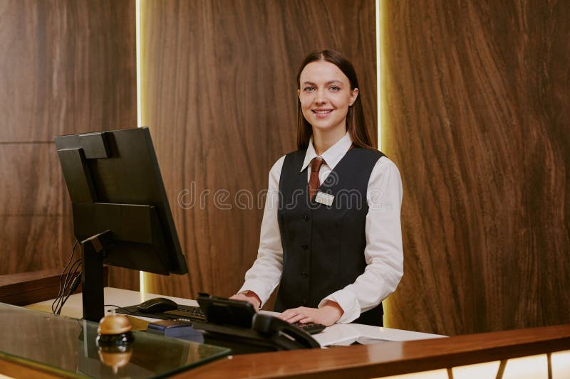Smiling Receptionist at Work Stock Photo - Image of luxurious ...