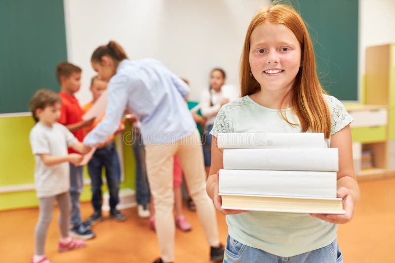 Smiling Redhead Schoolgirl Holding Stack of Books Stock Image - Image ...