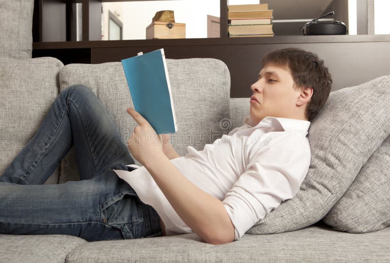 Smiling Relaxed Man Reading a Book Stock Photo - Image of happy ...