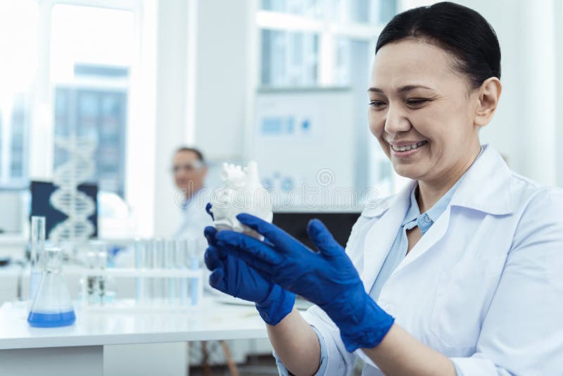Smiling Researcher Holding an Experimental Unit Stock Photo - Image of ...
