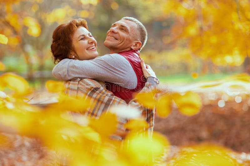 Smiling Romantic Boyfriend and Girlfriend in Park Hugging Stock Image ...