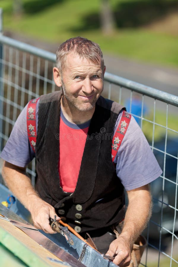 Smiling Roofer Welding the Gutter Stock Photo - Image of profession ...