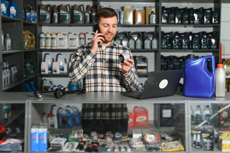 Smiling Salesman Auto Parts Store Stock Image - Image of industry, shop ...