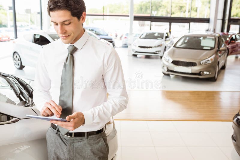 Smiling Salesman Using Tablet Near a Car Stock Image - Image of ...