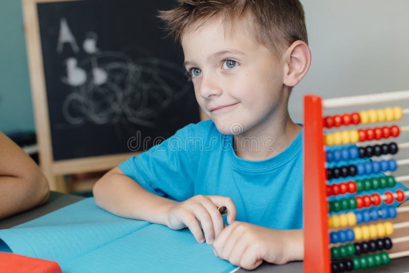 Portrait of a School Boy Working on Math Homework Stock Photo - Image ...