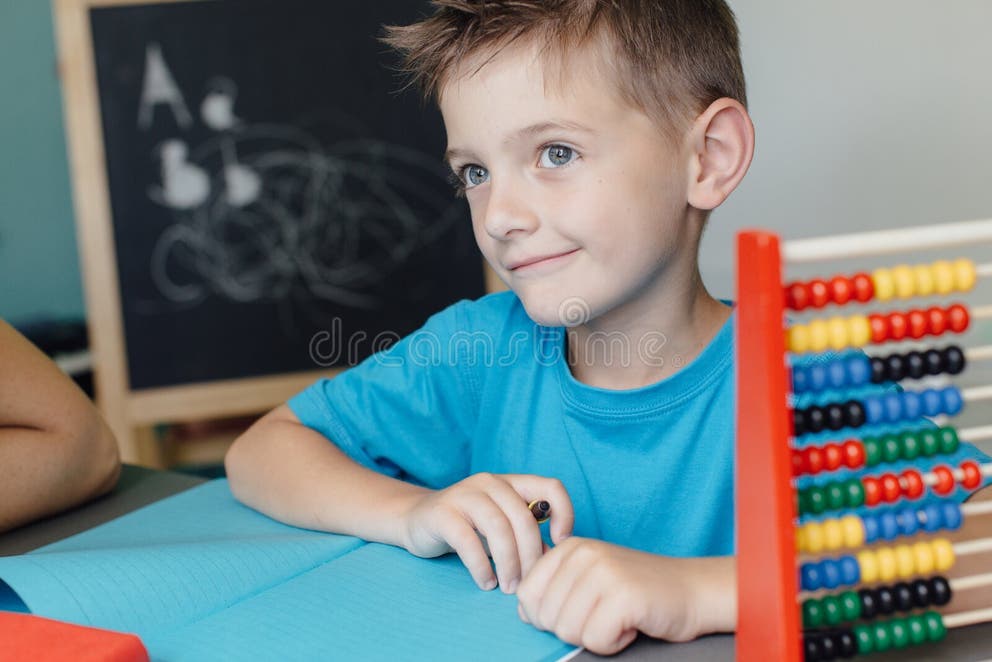 Smiling School Boy Working on Math Homework Stock Image - Image of ...
