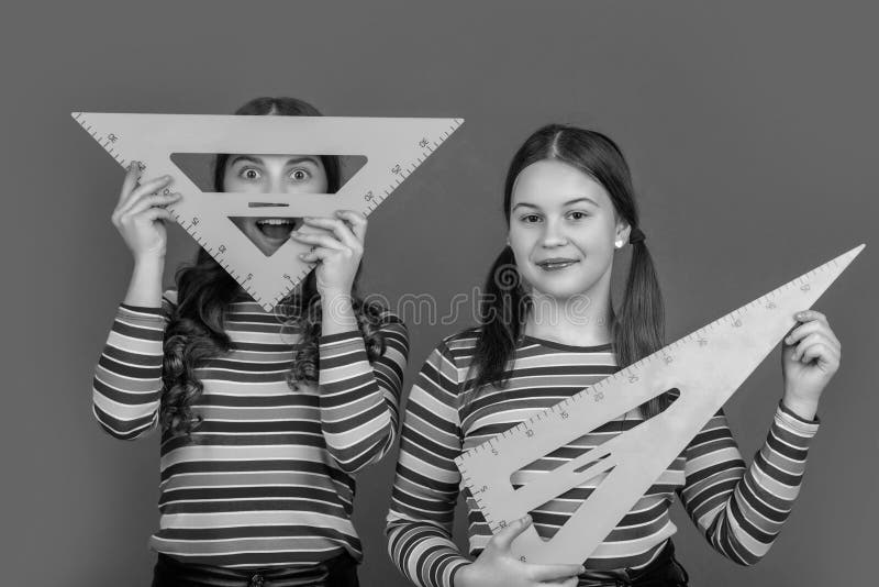 Smiling School Girls Hold Math Tool of Triangle Stock Photo - Image of ...