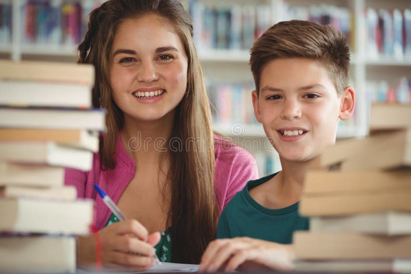 Smiling School Kids Doing Homework in Library at School Stock Image ...