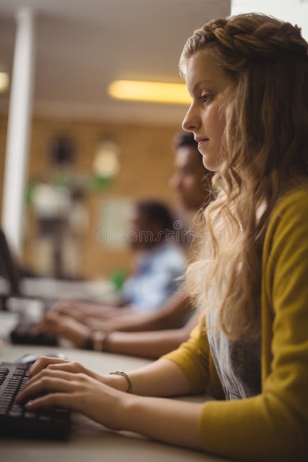 Smiling Schoolgirl Studying in Computer Classroom Stock Photo - Image ...