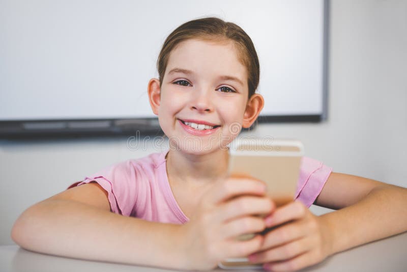 Schoolgirl Using Digital Tablet in Classroom Stock Image - Image of ...