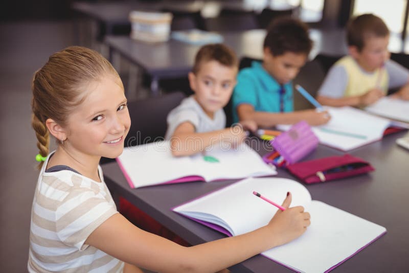 Smiling Schoolkids Doing Their Homework in Library Stock Photo - Image ...