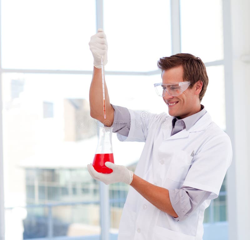 Smiling Scientist Examining a Test-tube Stock Image - Image of male ...