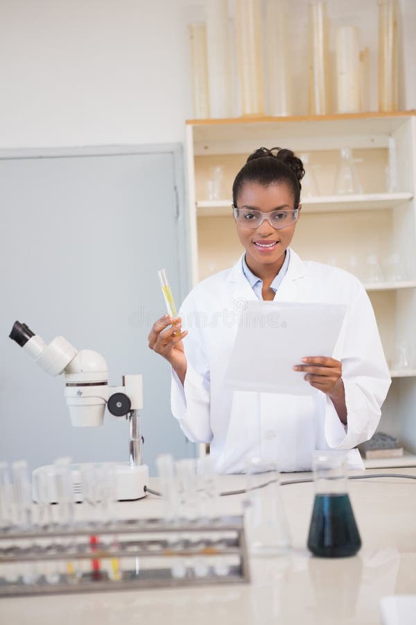 Smiling Scientist Looking at Camera and Holding Paper Stock Photo ...