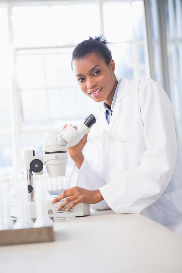 Smiling Scientist Looks in Microscope at Material Sample Stock Photo ...