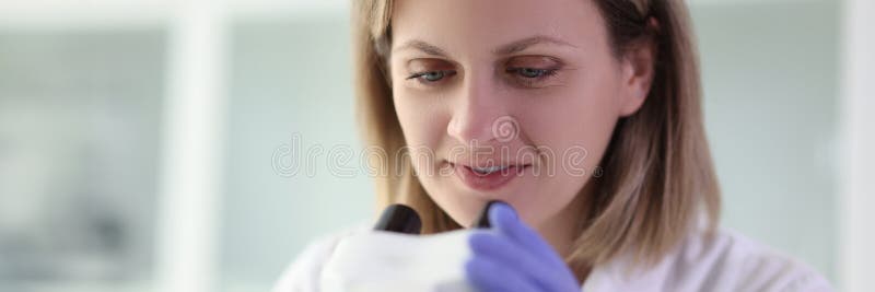 Smiling Scientist Looks in Microscope at Material Sample Stock Photo ...