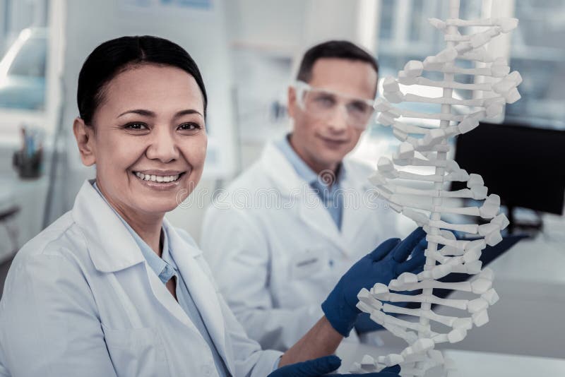 Smiling Scientist Trying To Decode DNA Secrets Stock Image - Image of ...