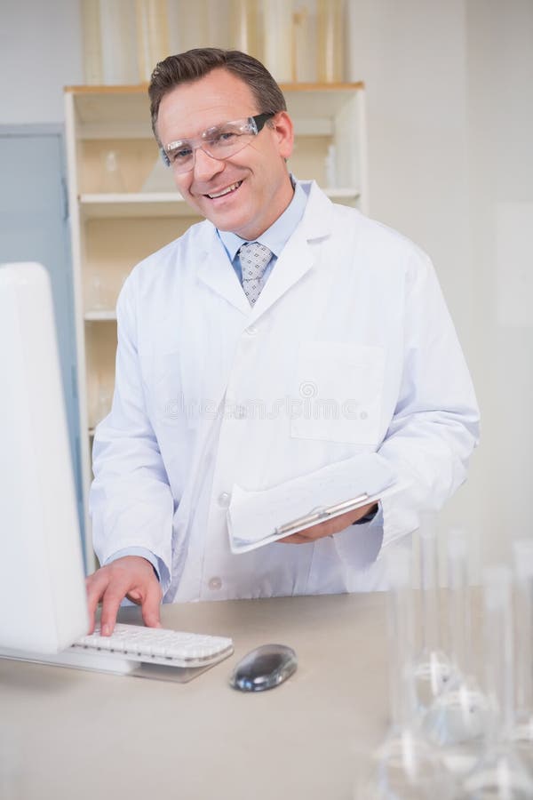 Smiling Scientist Using Computer Stock Image - Image of scientific ...